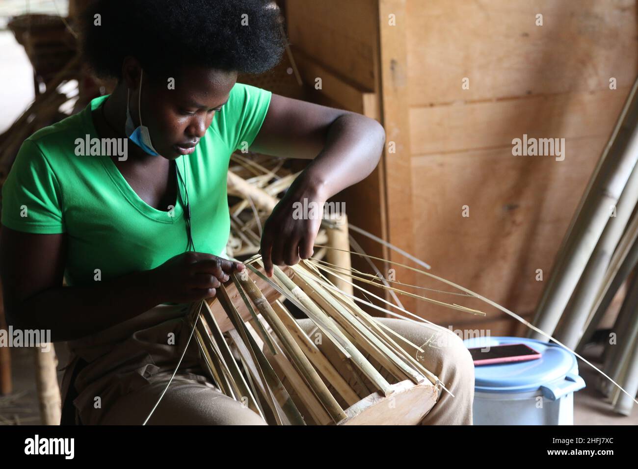 Kigali, Rwanda. 14th Jan, 2022. A Rwandan woman weaves a piece of ...