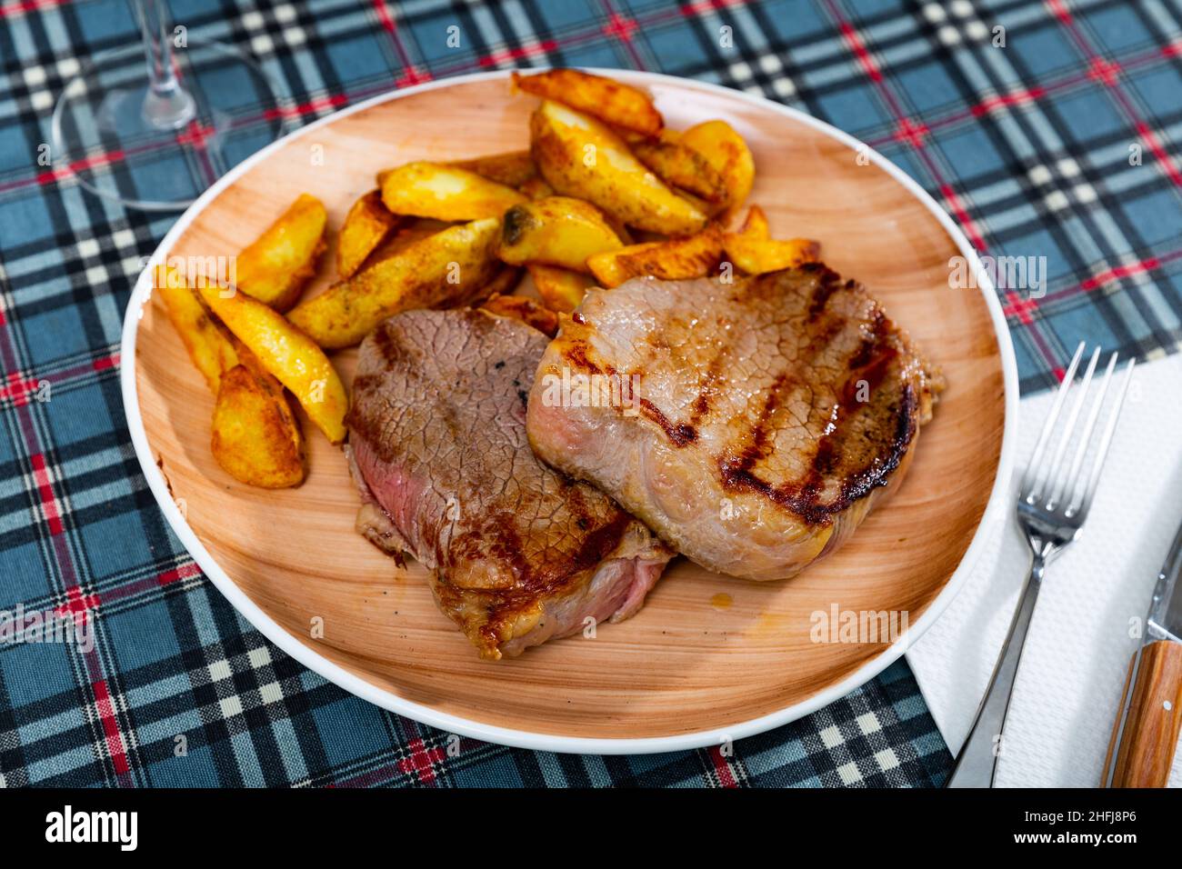 Traditional spanish grilled beef with potato Stock Photo - Alamy