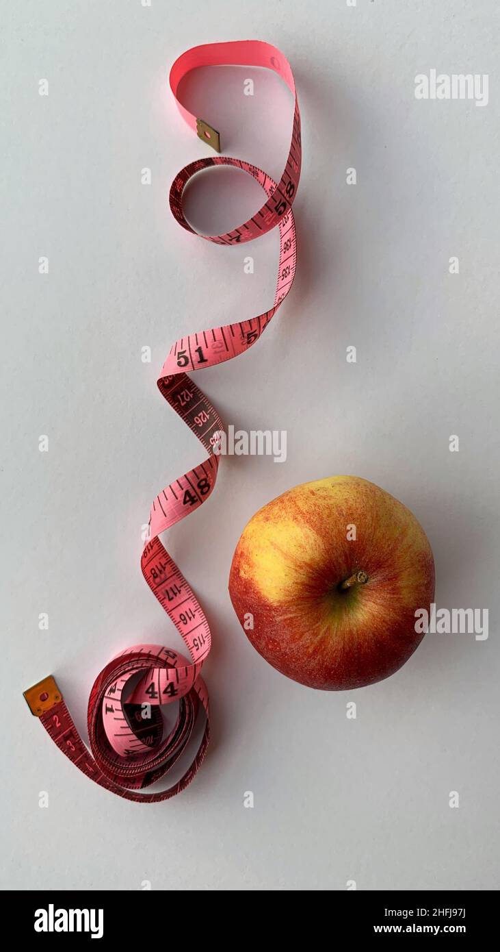 Diet and Healthy life loss weight slim Concept. Organic Red apple ...