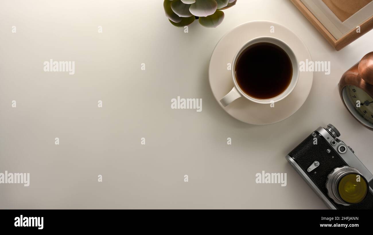 Minimalist working table with copy space on white background, coffee ...
