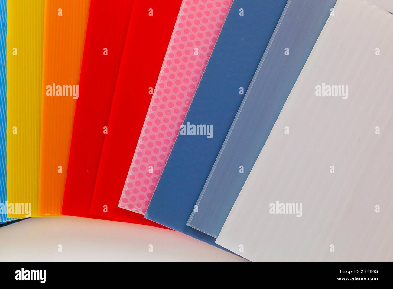 plastic packaging material in different colors Stock Photo - Alamy
