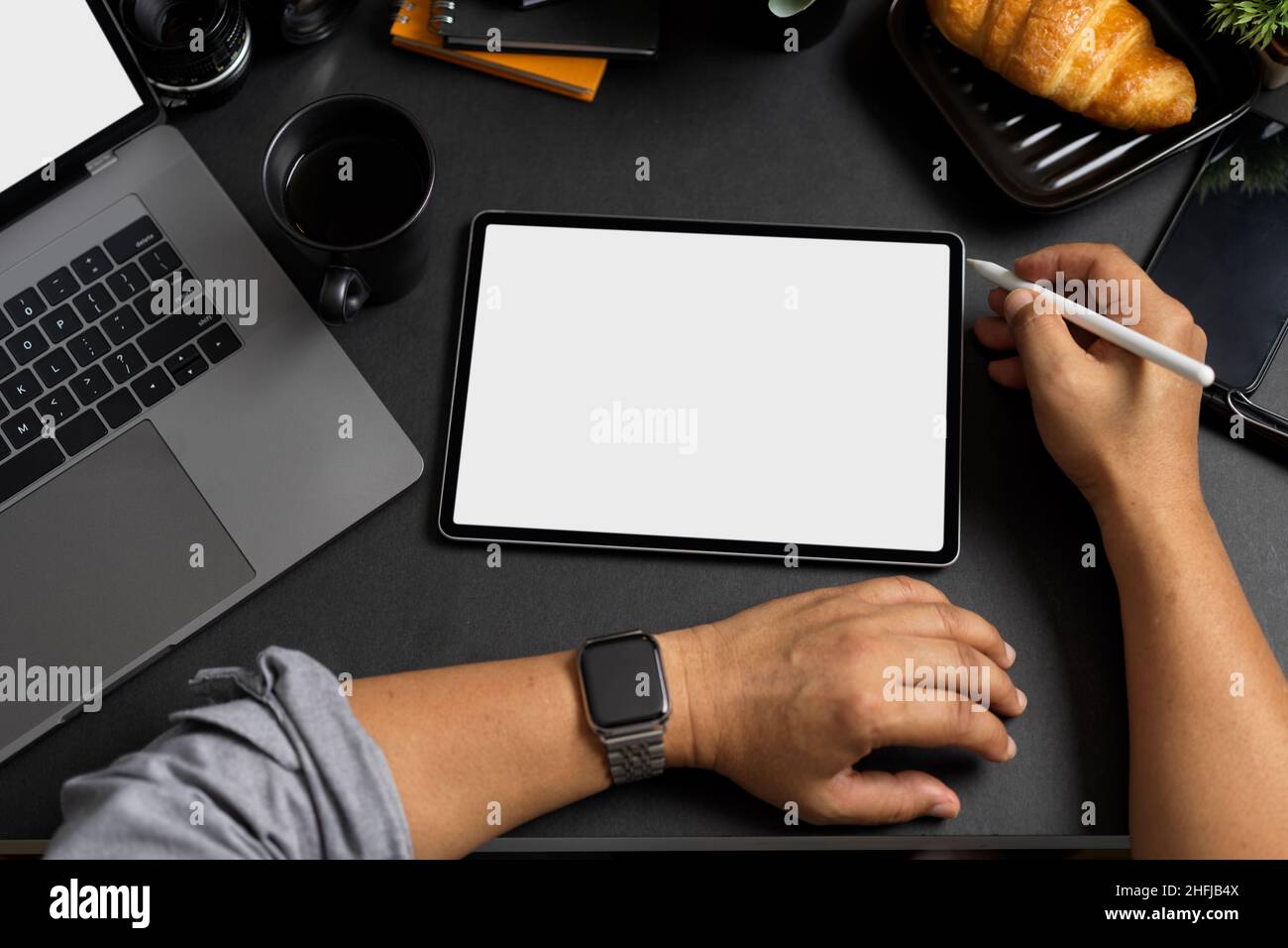 Professional businessman using digital tablet computer at his modern ...