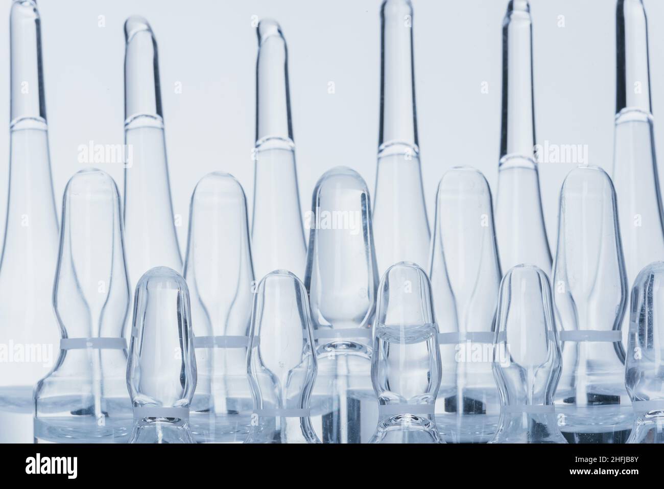 Glass medical ampoule vial for injection. Medicine is dry white drug ...