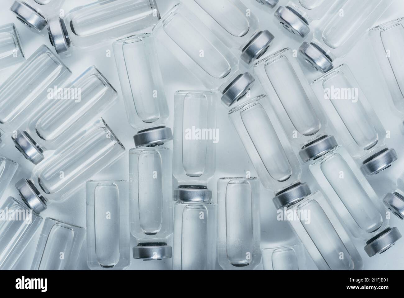 Glass medical ampoule vial for injection. Medicine is dry white drug ...