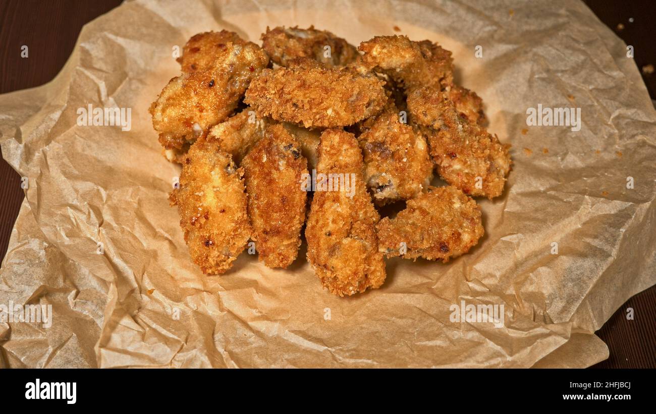 Cool beautiful fresh juicy cooked chicken wings in breading. Buffalo ...