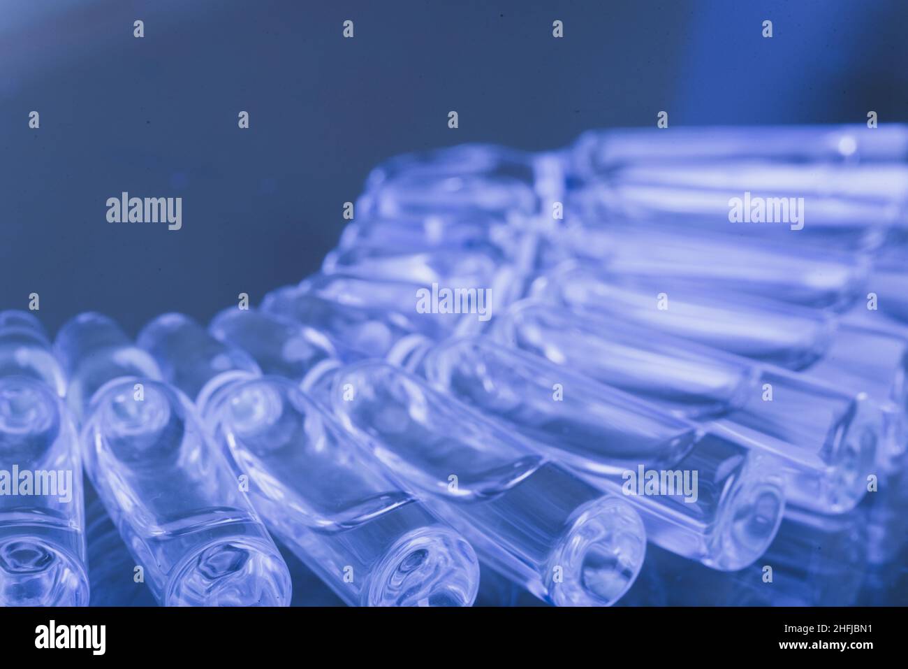 Glass medical ampoule vial for injection. Medicine is liquid sodium ...