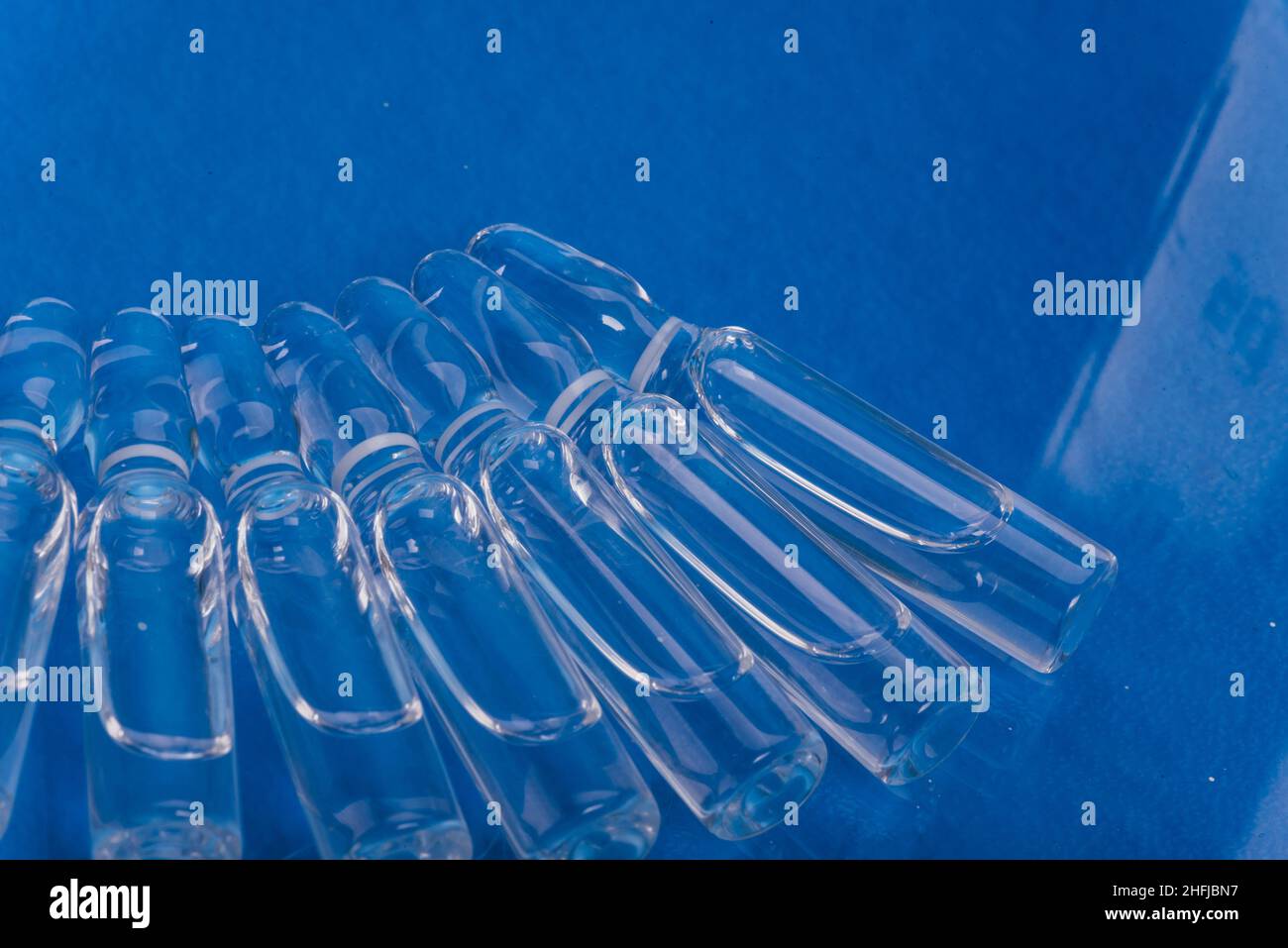 Glass medical ampoule vial for injection. Medicine is liquid sodium ...