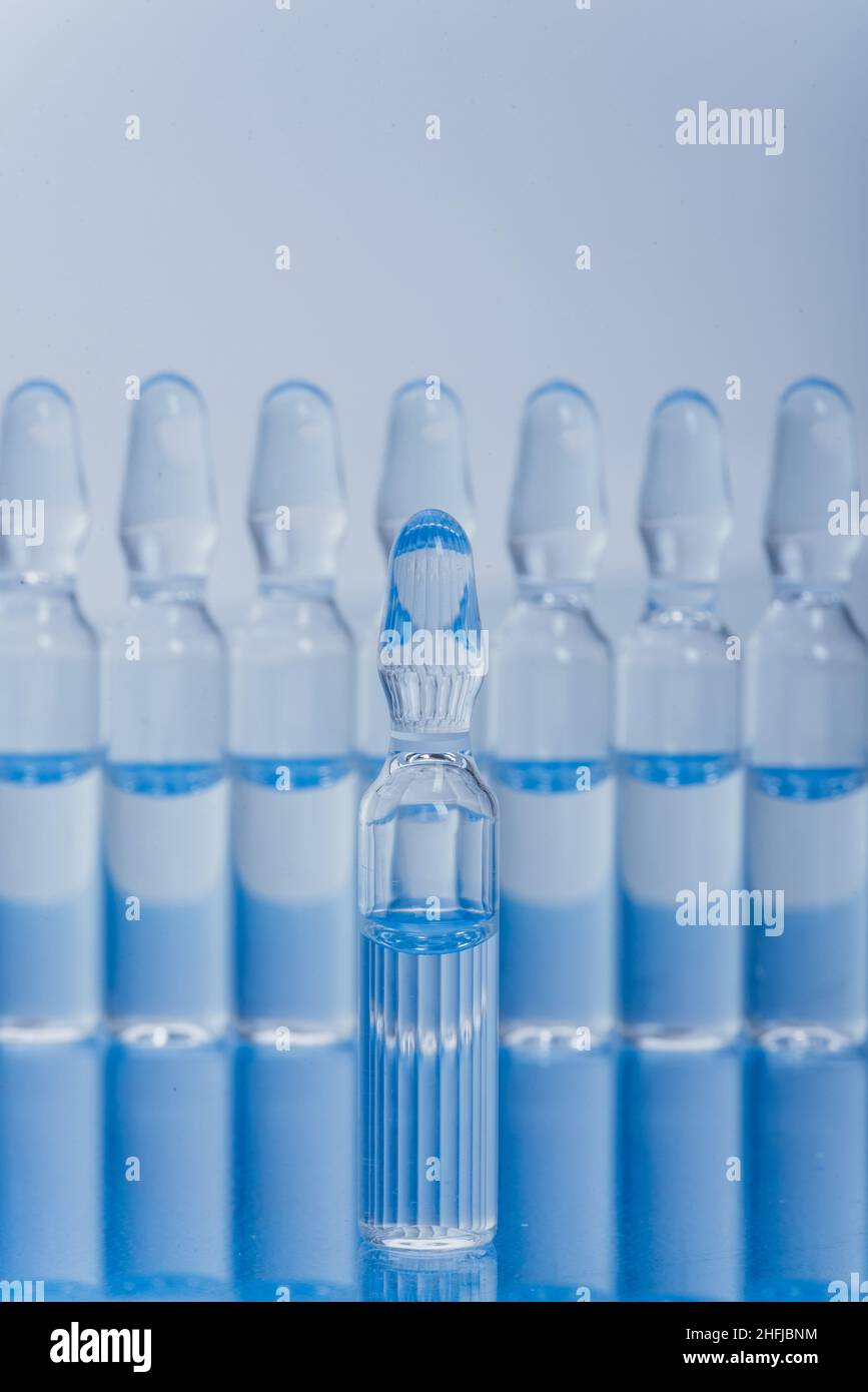 Glass medical ampoule vial for injection. Medicine is liquid sodium ...