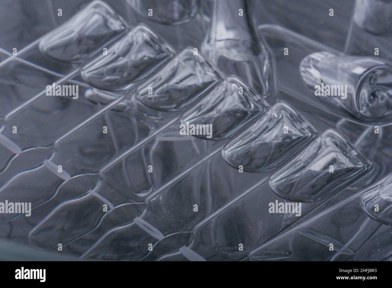 Glass medical ampoule vial for injection. Medicine is liquid sodium ...