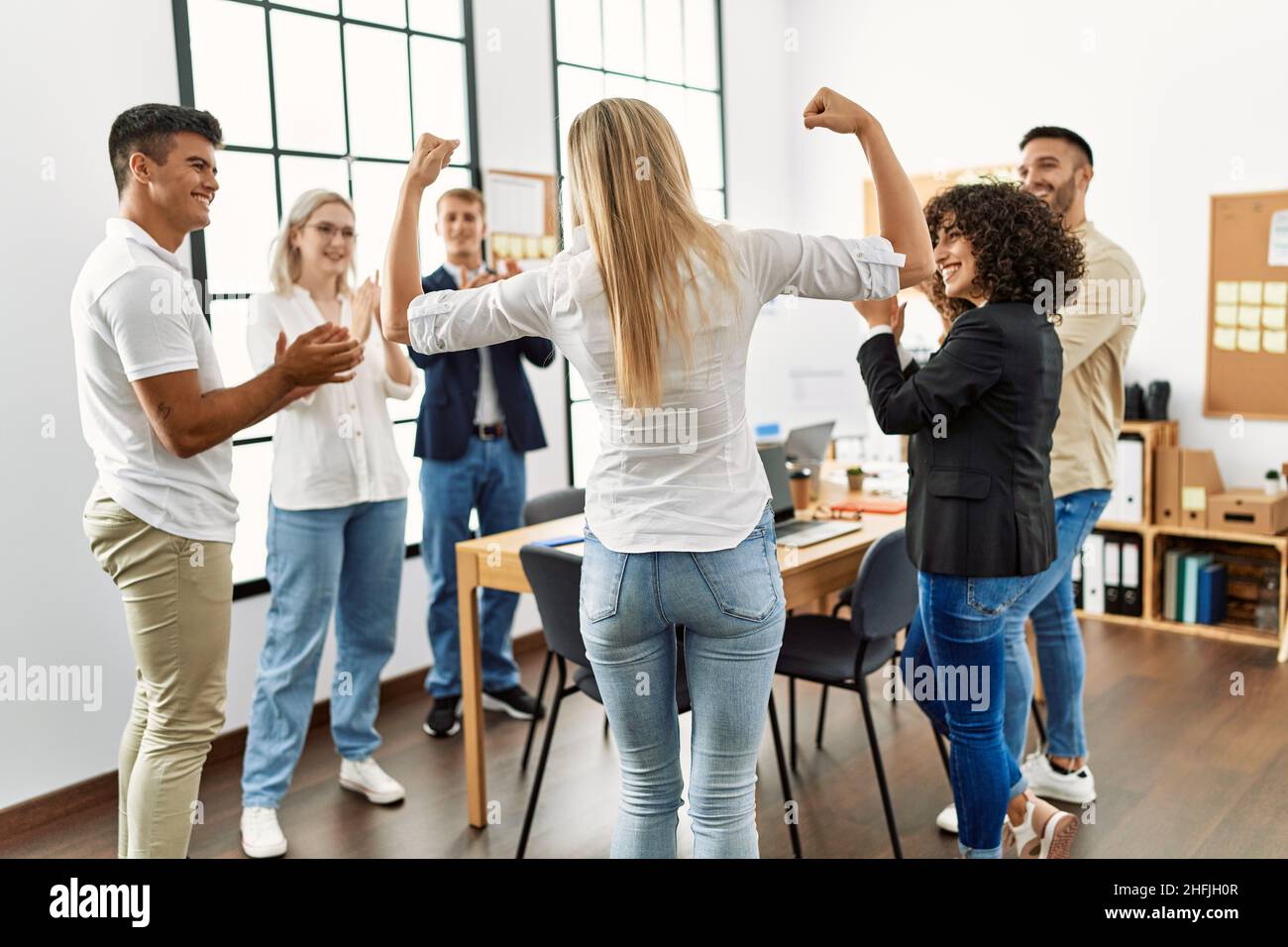 Group of young business workers smiling and clapping. Young ...