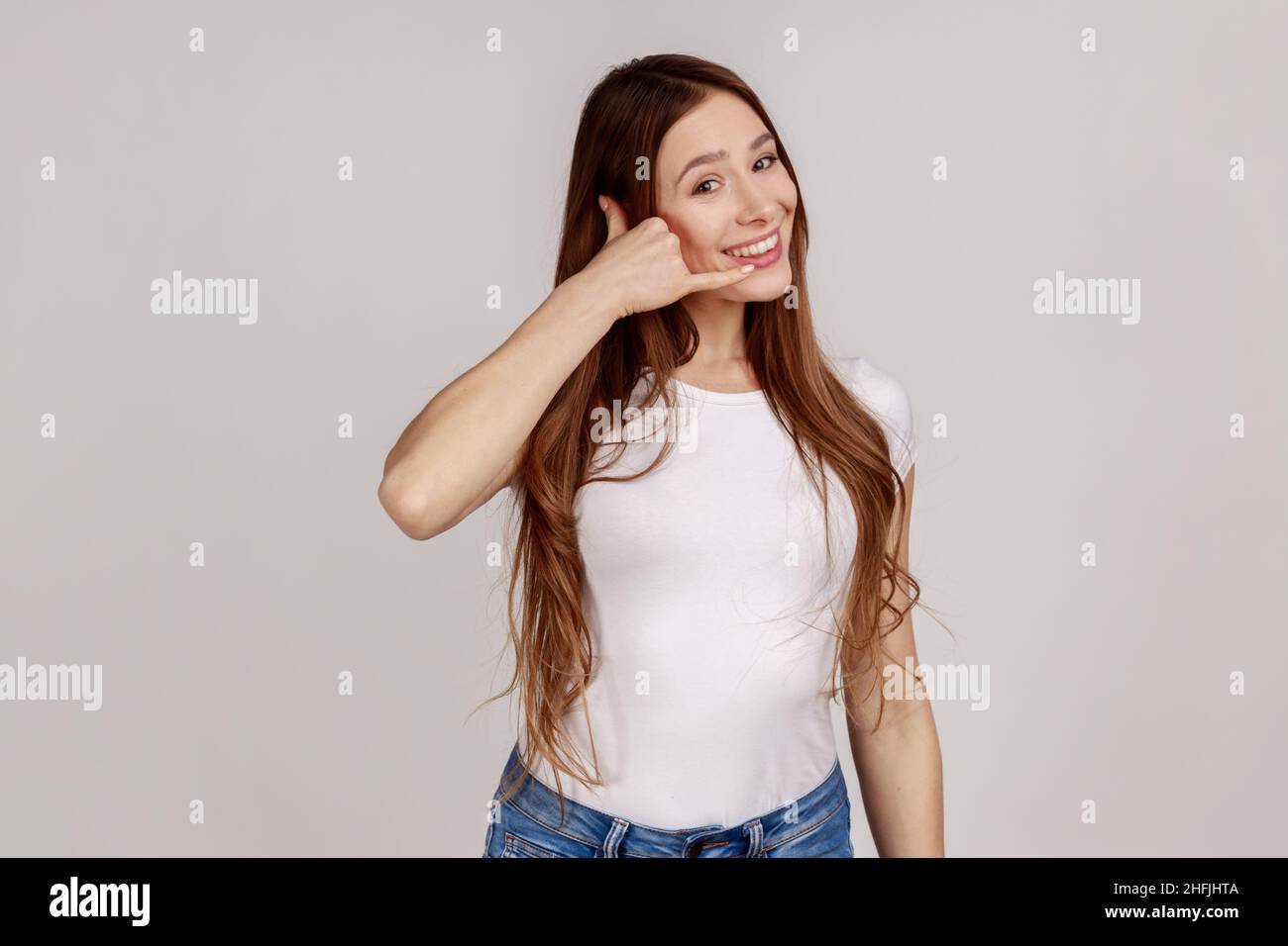 Hey handsome, call me. Beautiful woman flirting holding fingers near ...