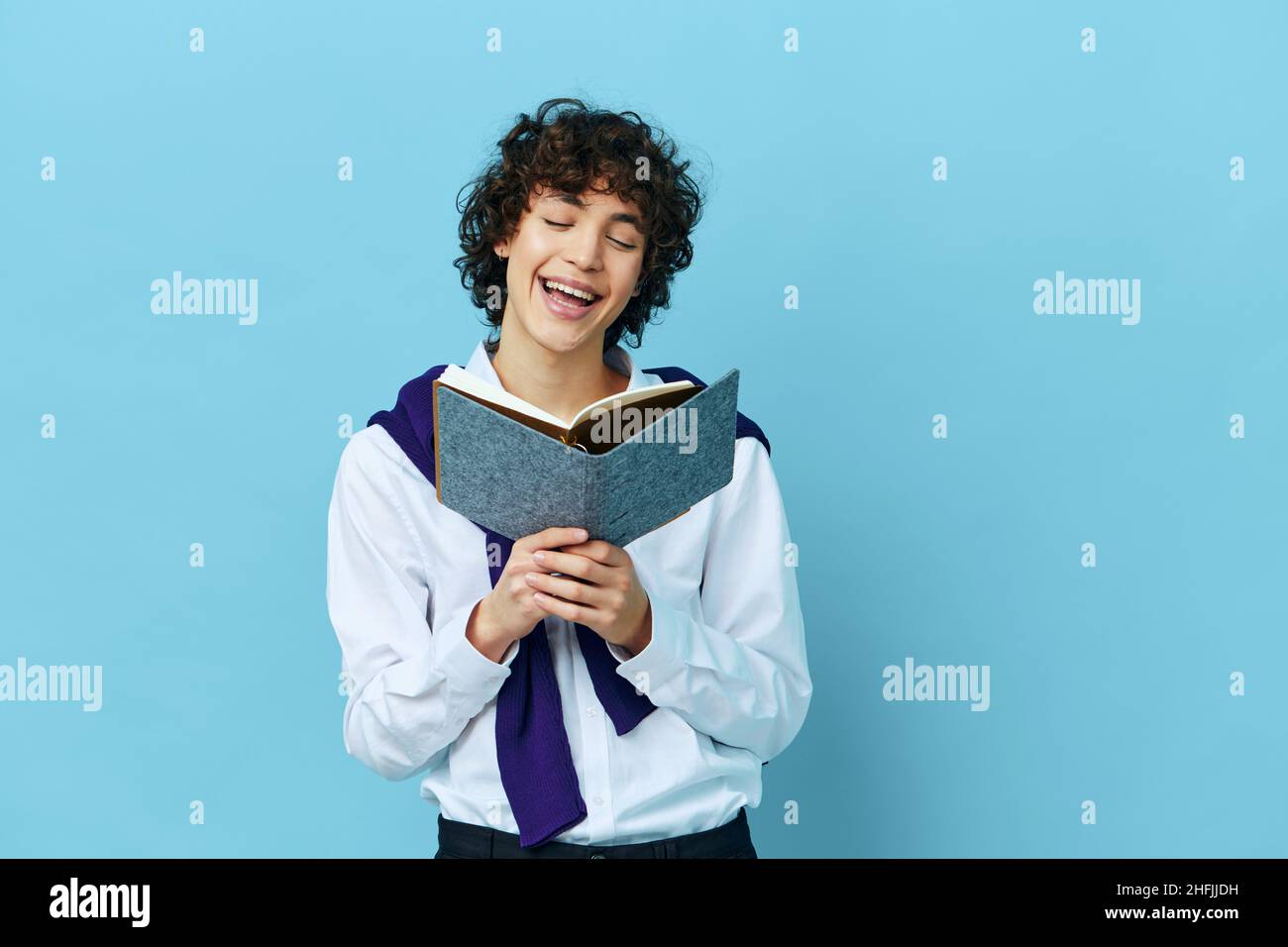 student with a book college learning jacket blue background Stock Photo ...