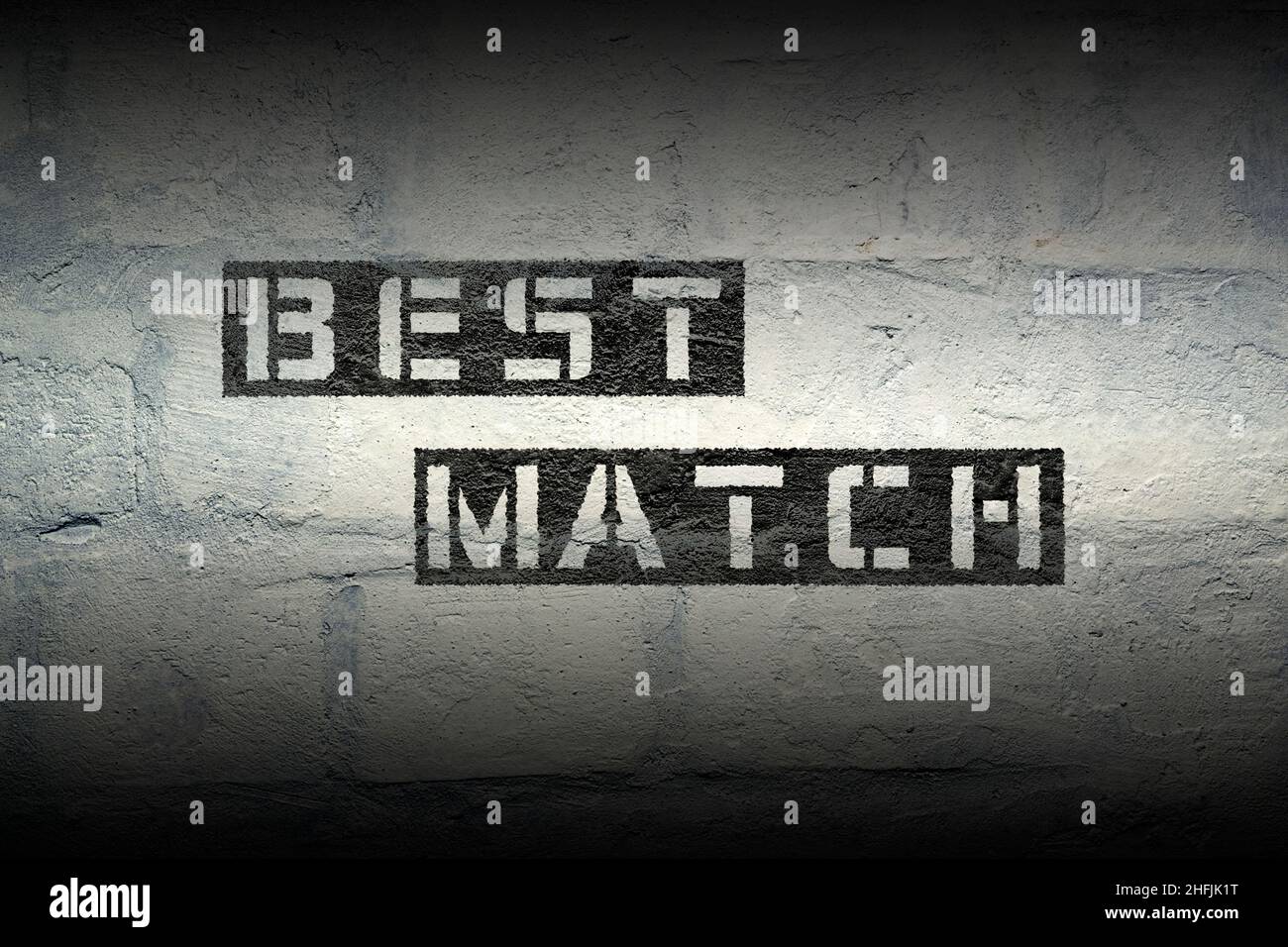 best match stencil print on the grunge white brick wall Stock Photo - Alamy