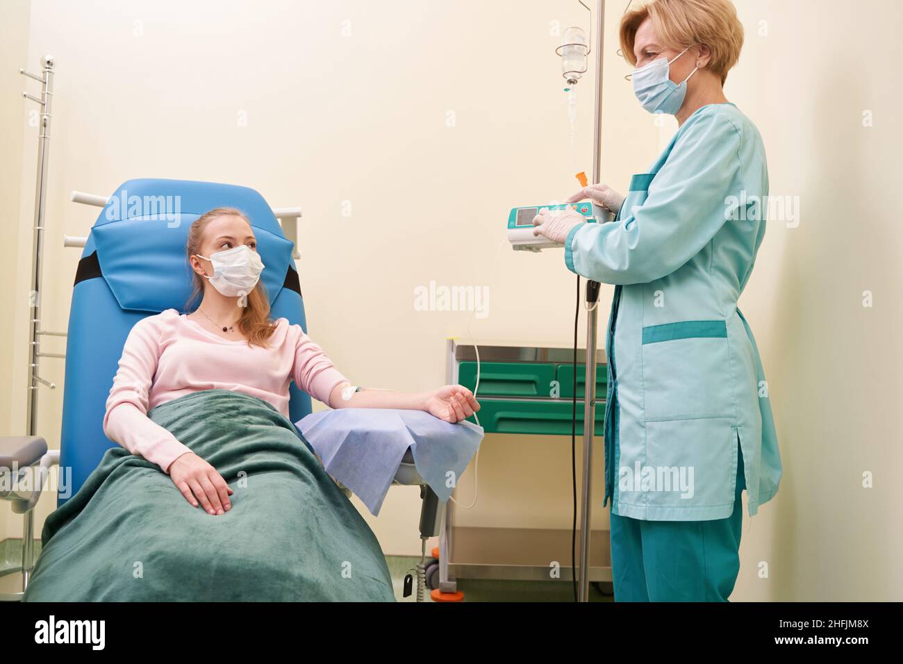 Attentive female person looking at her practitioner Stock Photo - Alamy