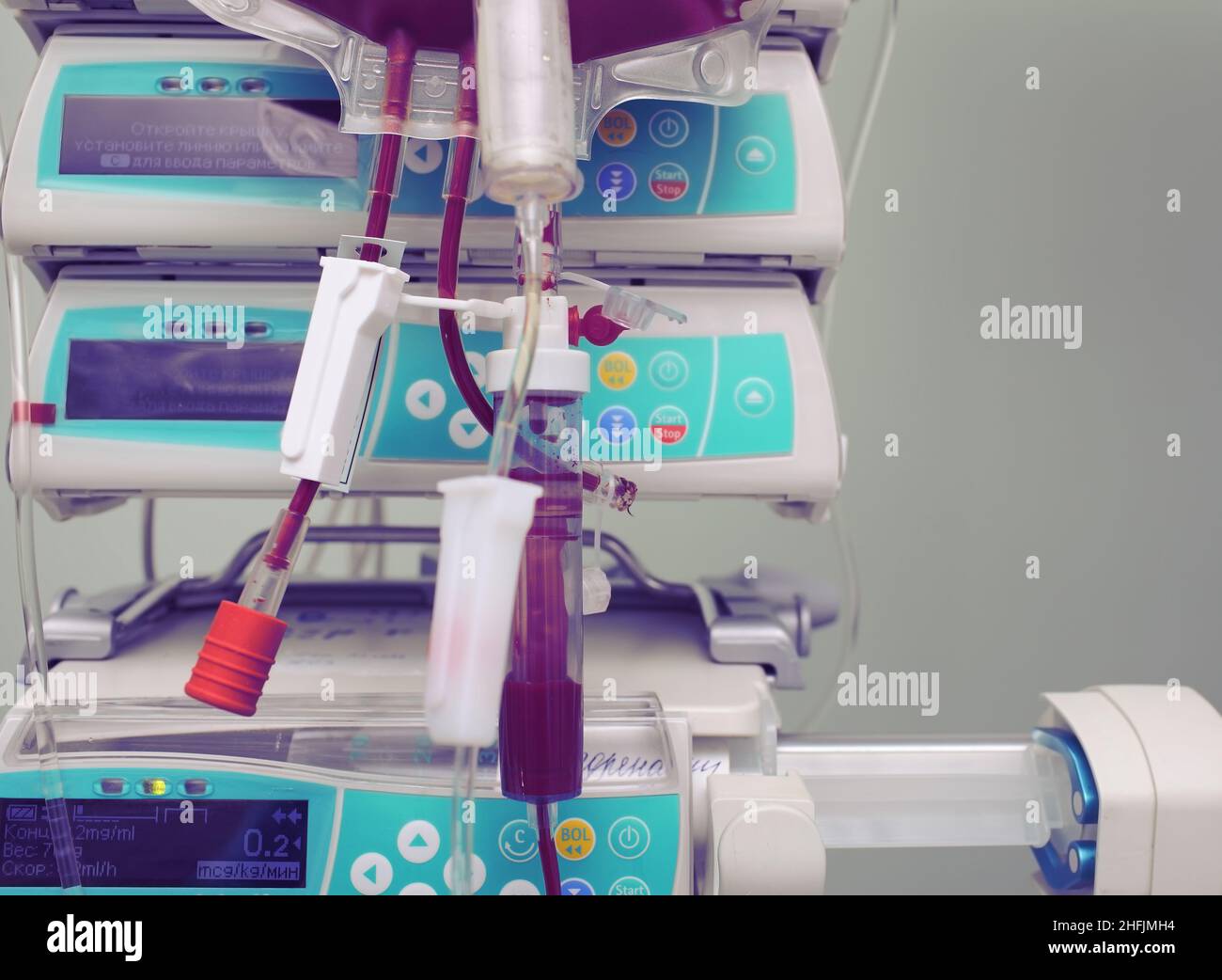 Intensive care treatment with drug and blood infusion equioment Stock ...