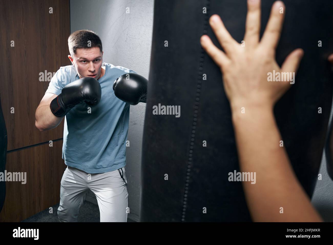 Focused sportsman getting ready for boxing workout Stock Photo - Alamy