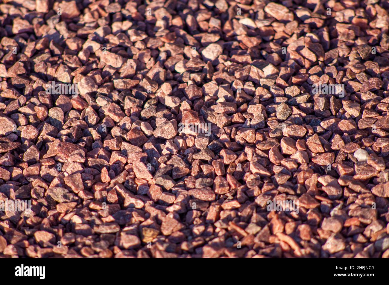 Red decorative granite crushed stone of a small fraction, a background ...