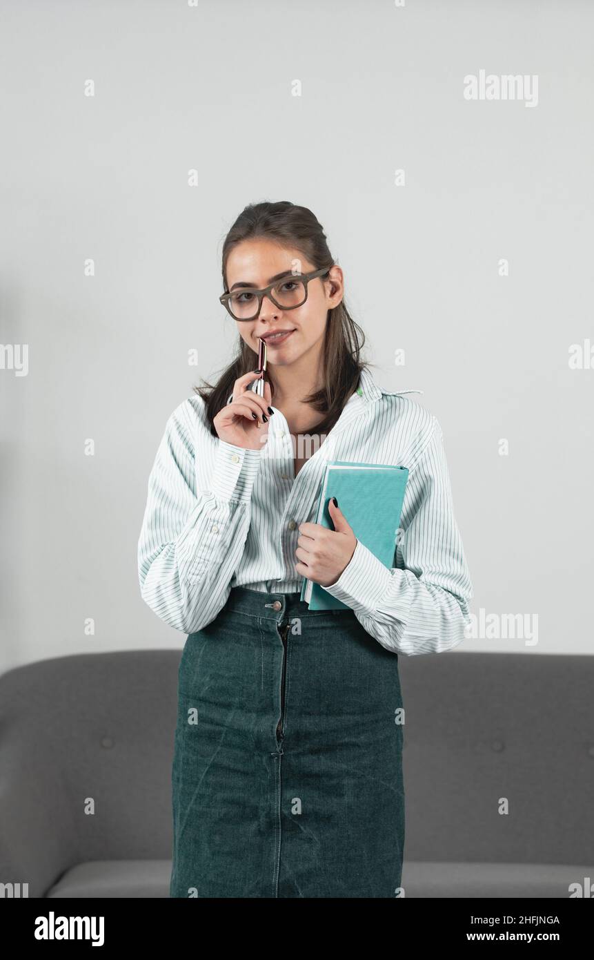 Thinking student or young teacher. Young businesswoman working on ...