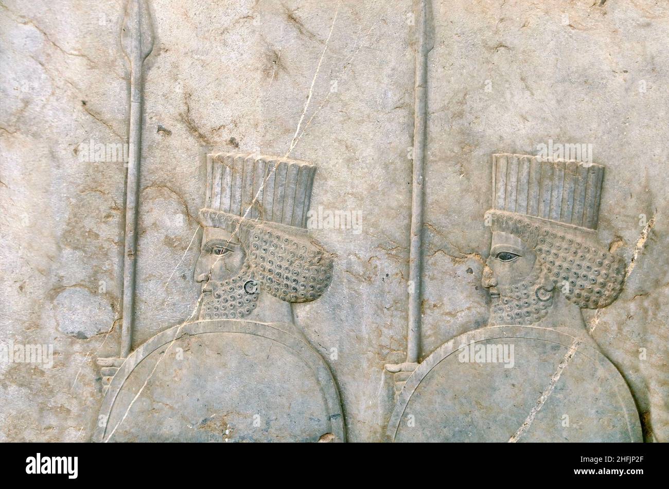 Ancient Wall With Bas Relief With Assyrian Warriors With With Spears And Shields Persepolis