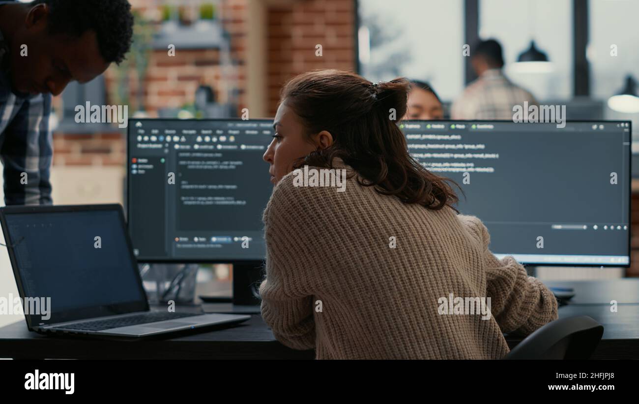 Software Programer Putting Laptop With Source Code On Colleague Coder Desk Asking For Opinion