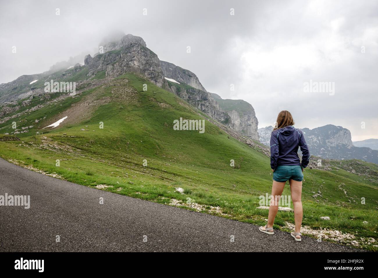 Young travel woman enjoying landscape view of Sedlo pass in Durmitor ...