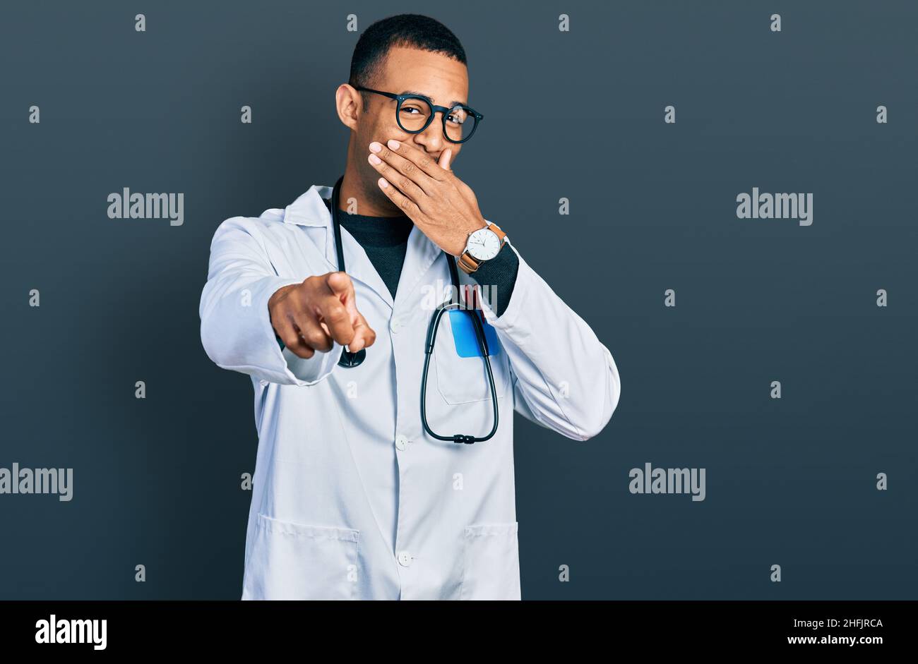 Young african american man wearing doctor uniform and stethoscope ...