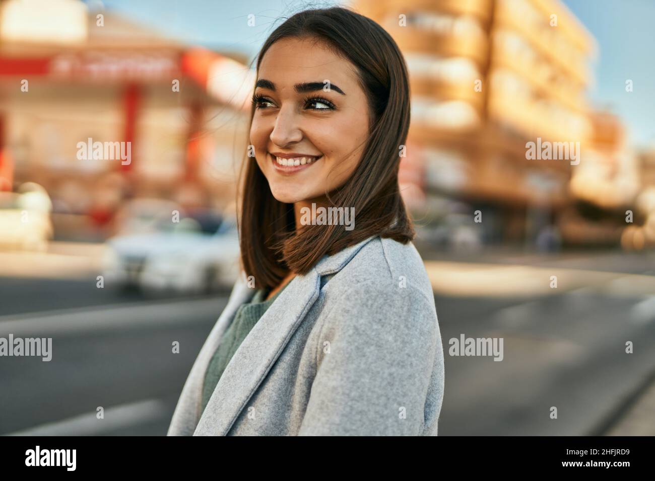 Young hispanic girl smiling happy standing at the city Stock Photo - Alamy