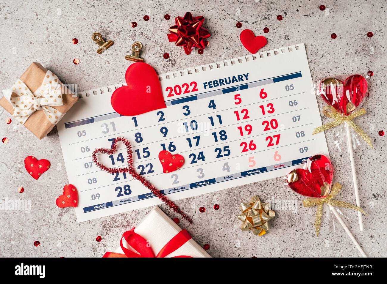 Flat lay of Valentines day calendar composition. Top view Gifts, paper ...