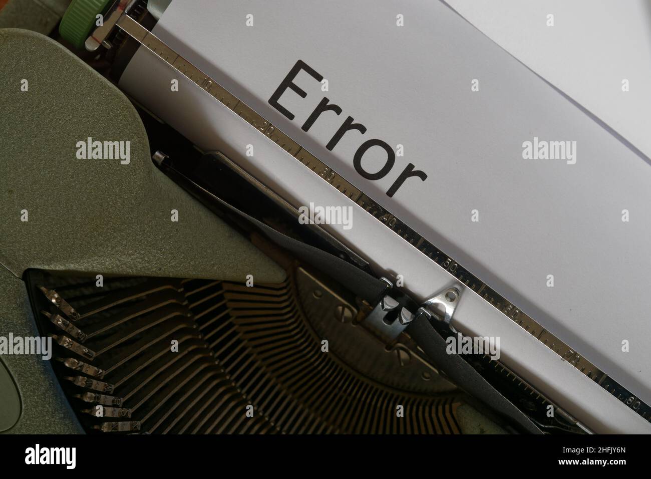 Error - word typed on white paper in typewriter platen Stock Photo - Alamy