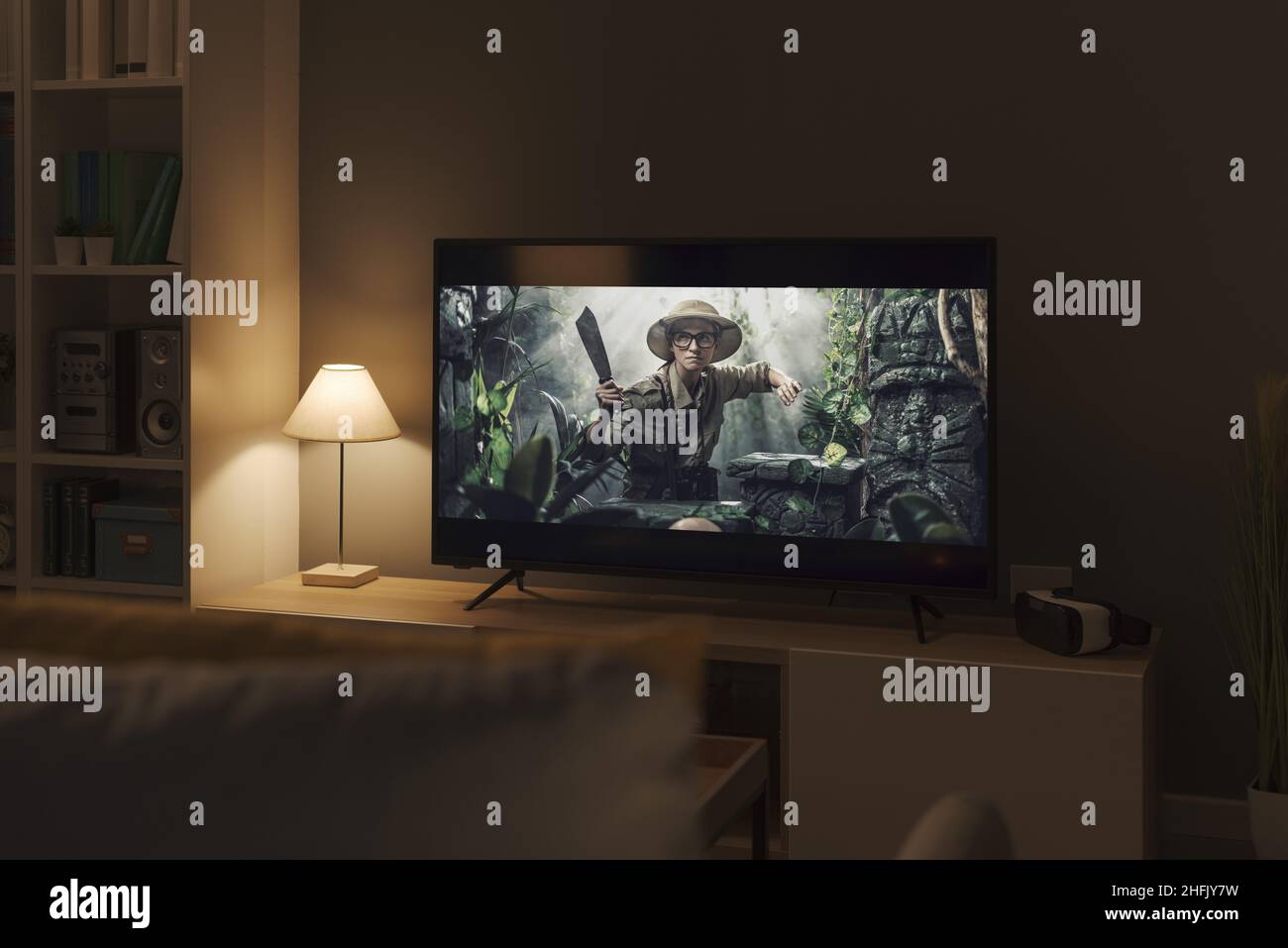 Exciting adventure movie on a widescreen TV and living room interior ...