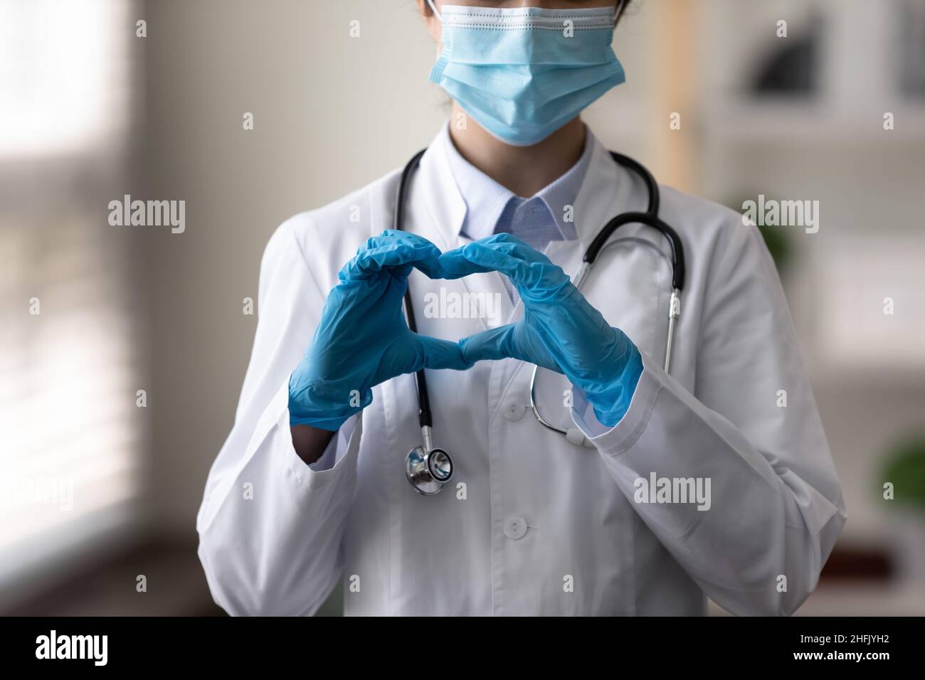 Close up young Indian doctor making heart sign Stock Photo - Alamy