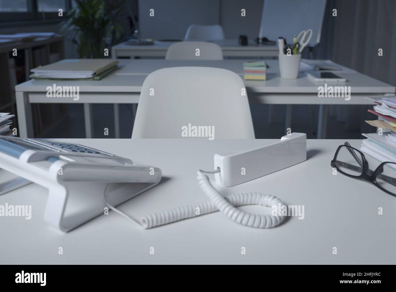 Office desktop telephone with receiver off the hook Stock Photo - Alamy
