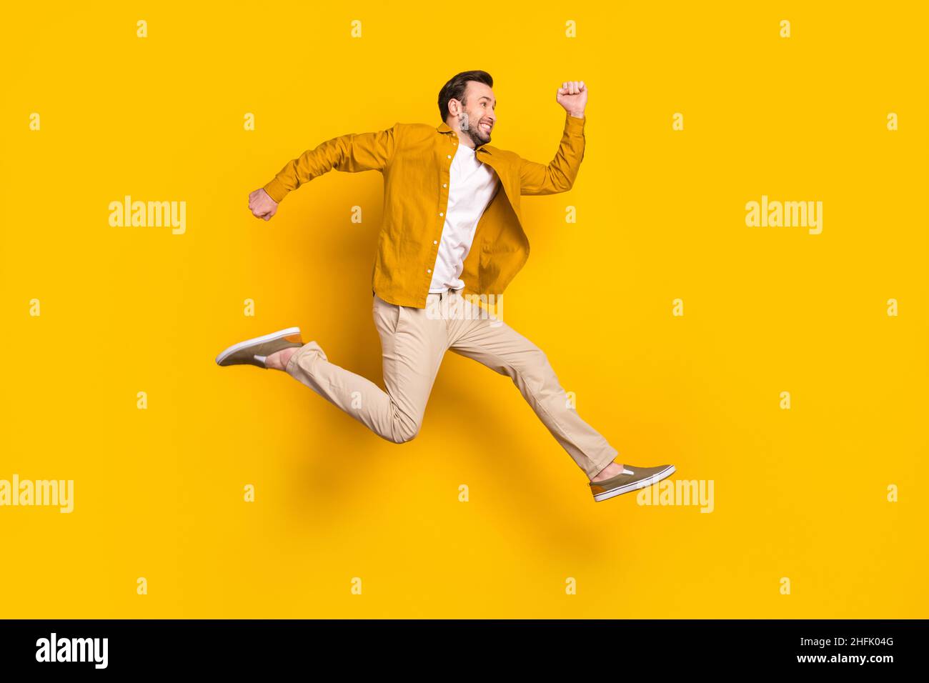 Full length photo of funky cute young guy wear casual clothes jumping ...