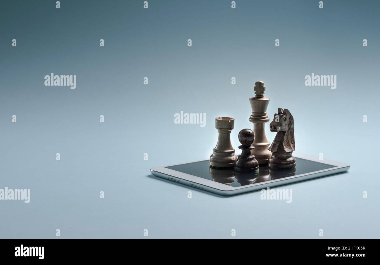 Chess pieces on a digital tablet: online chess video game concept Stock ...