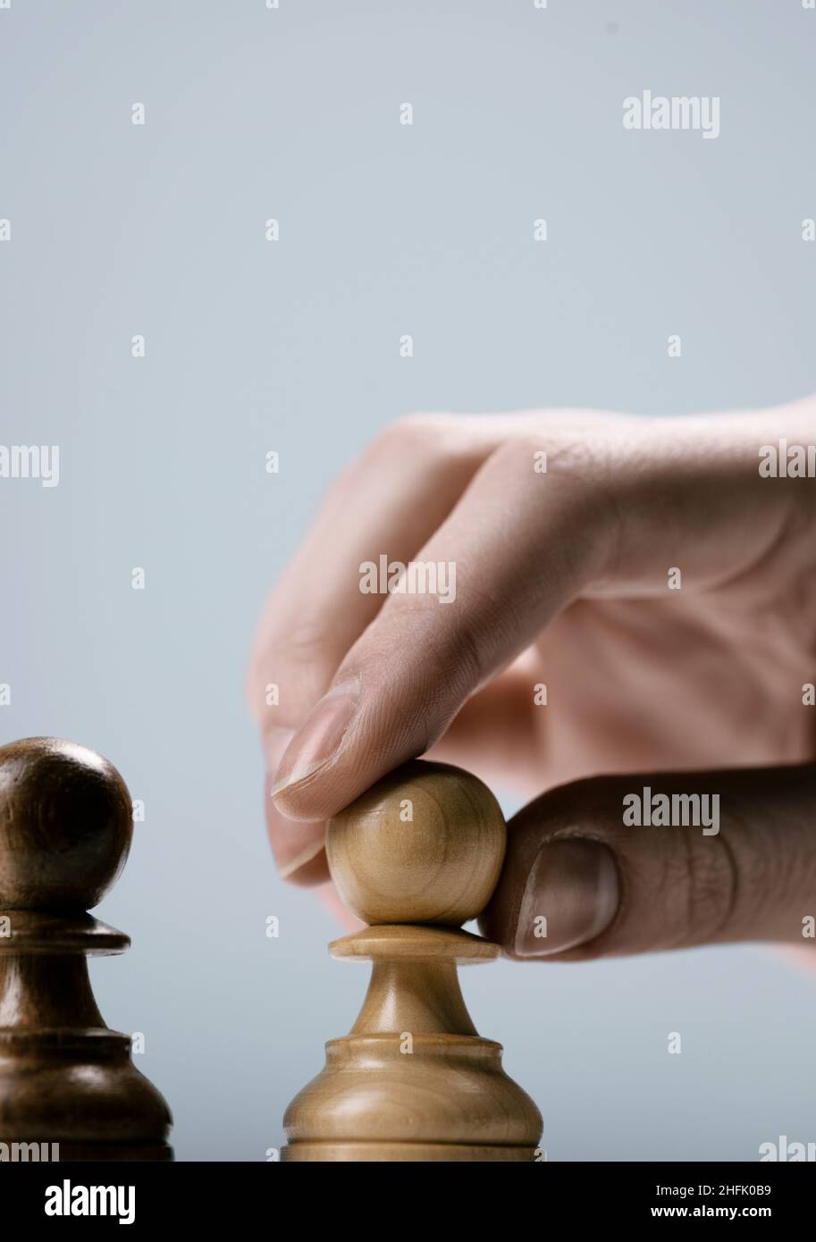 Professional player moving a pawn on the chessboard, chess game and ...