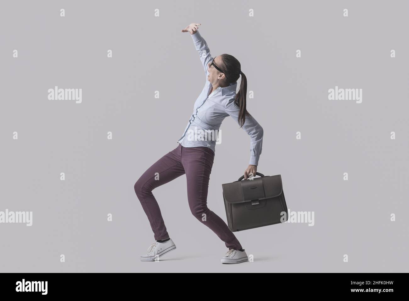 Scared woman protecting herself from a danger, something is falling ...