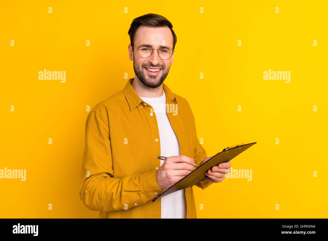 Photo of cute positive young guy wear casual clothes glasses smiling ...