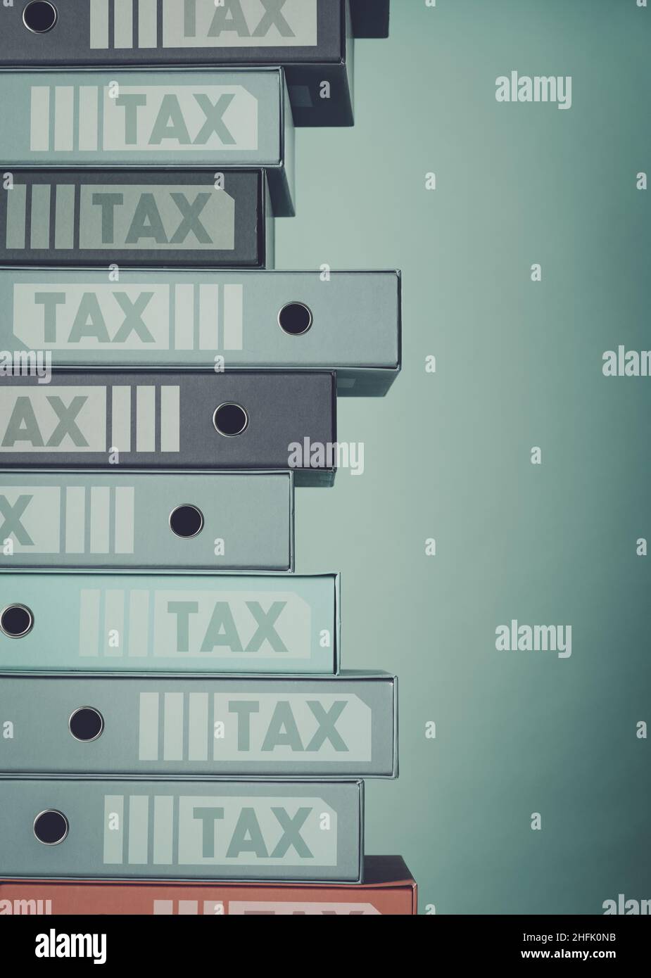 Pile of ring binders that contain tax documents and forms, tax ...