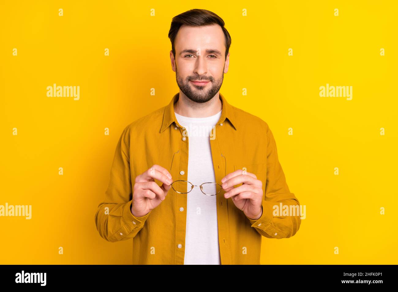 Photo of pretty confident young gentleman dressed casual outfit arms ...