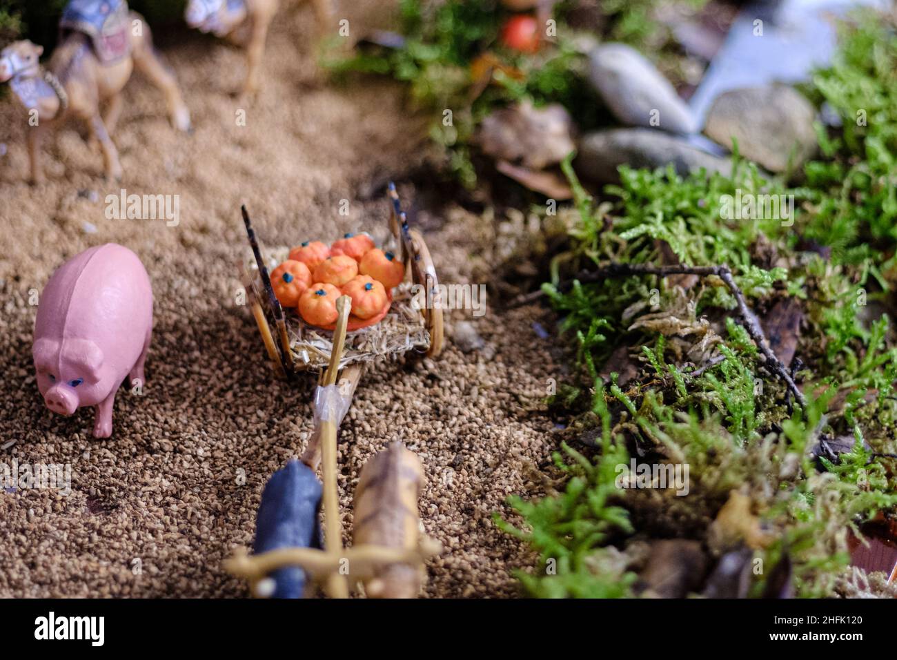 Traditional agriculture scene made tih tiny plastic toys with pumpkins ...