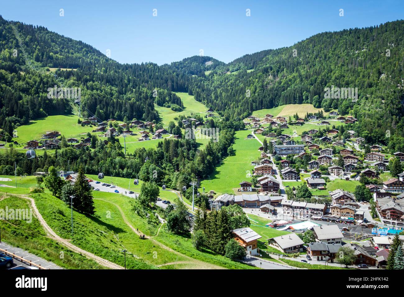 Gondola above the village of La Clusaz in summer, France Stock Photo ...
