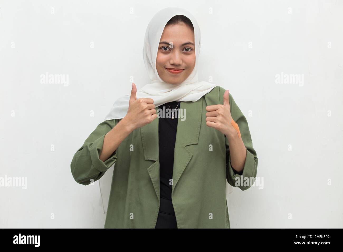 Asian muslim woman wearing hijab with ok sign gesture Stock Photo - Alamy