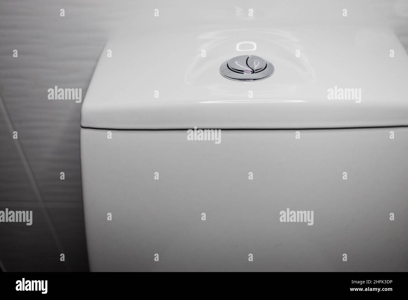 flushing toilet button of toilet WC. two separate buttons Stock Photo - Alamy