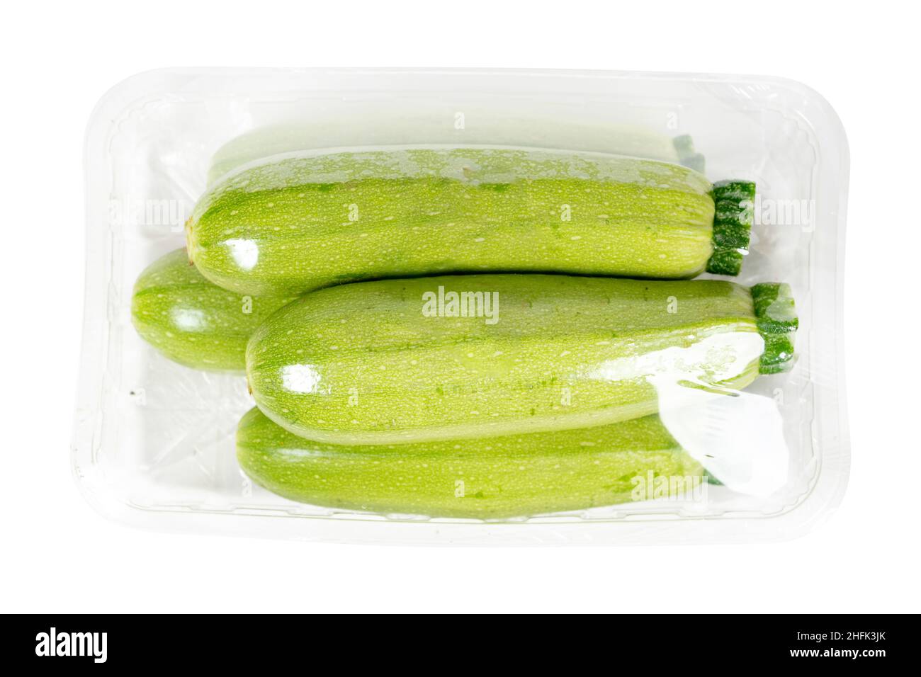 Packaged and labeled fresh zucchini on isolated white background Stock ...