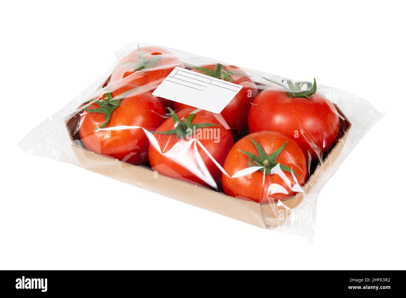 Packed and labeled fresh tomatoes on isolated white background Stock Photo - Alamy