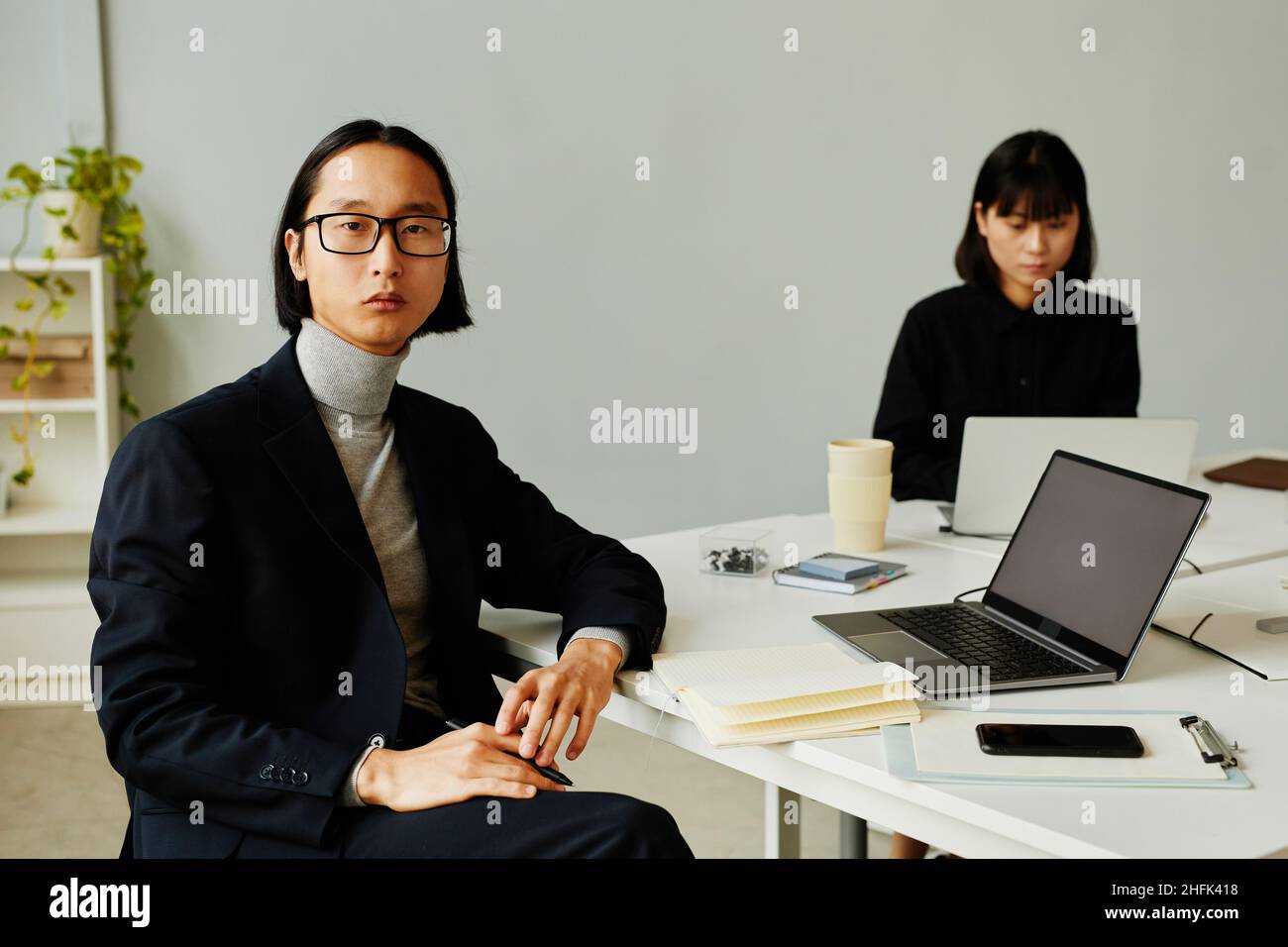 Portrait serious boss sitting table hi-res stock photography and images ...