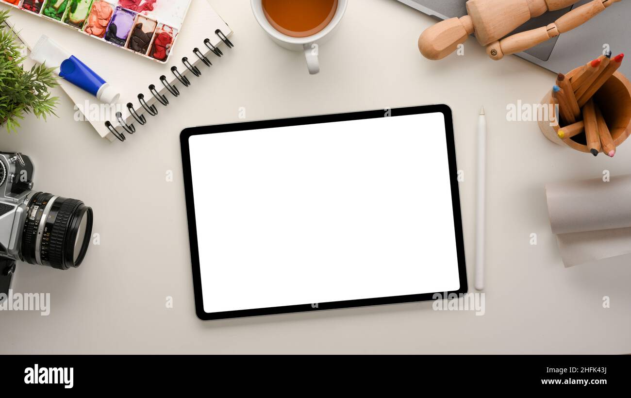 Creative workplace flat lay mockup with tablet touchpad white screen ...