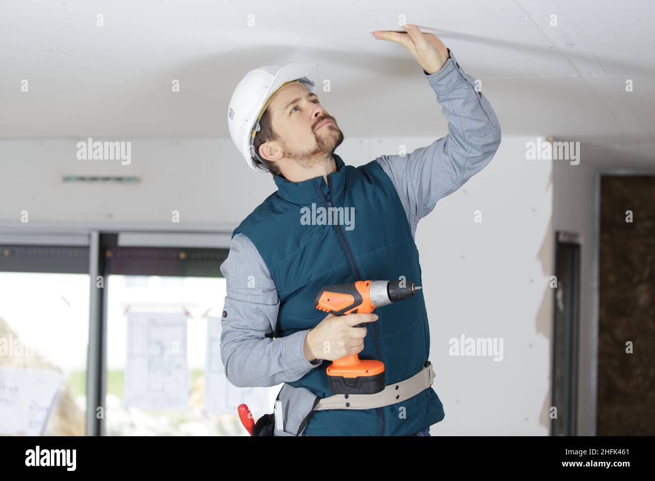 installing a spotlight in the room Stock Photo - Alamy