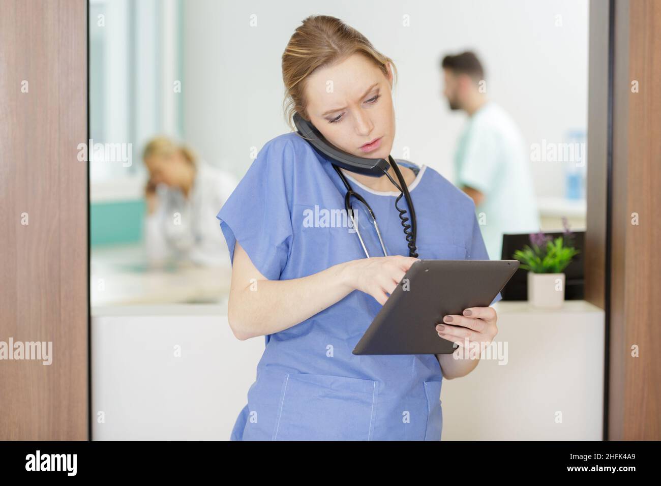 female emergency operator answers calls Stock Photo - Alamy