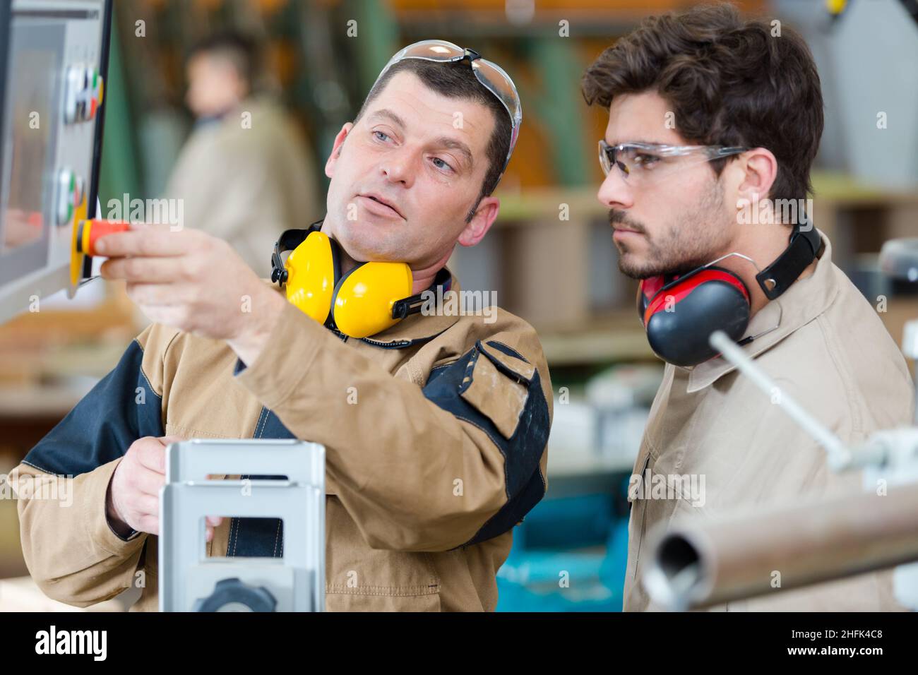 man operating big industrial machine Stock Photo - Alamy